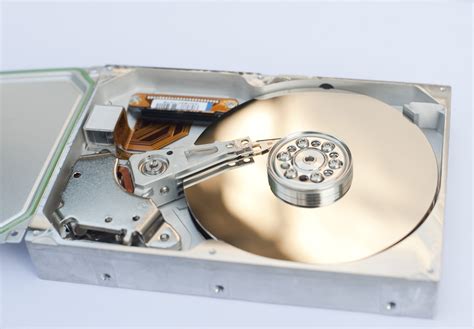 Free Image Of Hard Drive With Gold Colored Disk Freebie Photography