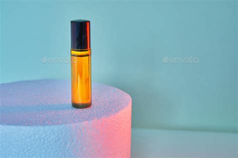 Dropper Bottle For Perfume Bottles Without Labels On A White Background With Colored Lights