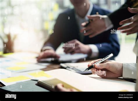 Male Businessman Pointing To Take Summarizing Marketing Strategy