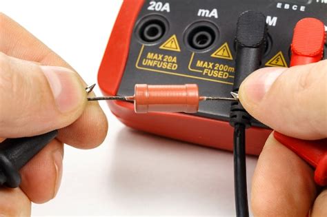 Premium Photo Test Resistor With Multimeter On White