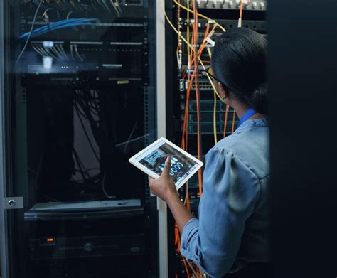Premium Photo Server Room Engineer And Woman With A Tablet For
