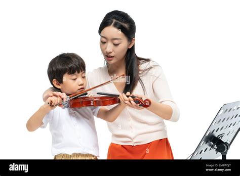 The Female Teacher Guide The Boy Playing Musical Instruments Stock