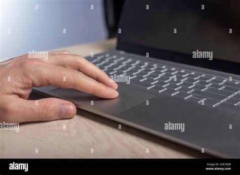 Hand On Laptop Touchpad Tapping And Scrolling With Fingers Close Up