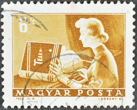 Cancelled Postage Stamp Printed By Hungary That Shows Telex Operator Editorial Stock Image