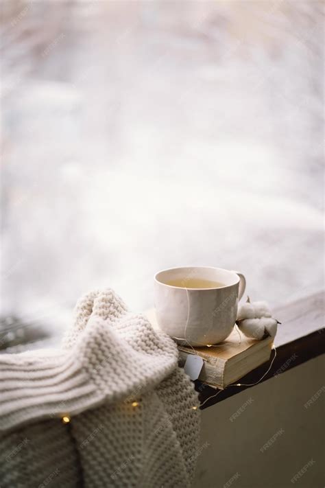 Premium Photo Cozy Winter Still Life Cup Of Hot Tea And An Open Book