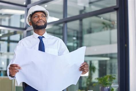 Premium Photo Black Man Architect And Blueprint In Construction
