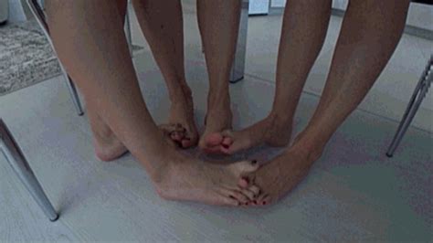 3 Girls Barefoot Sitting At A Table Interlocking Their Toes C Lorys