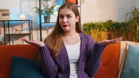 Confused Young Woman Feeling Embarrassed About Ambiguous Question