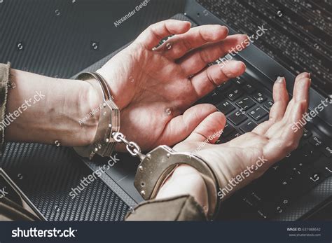 Hacker Hands Behind Handcuffs On Laptop Stock Photo Shutterstock