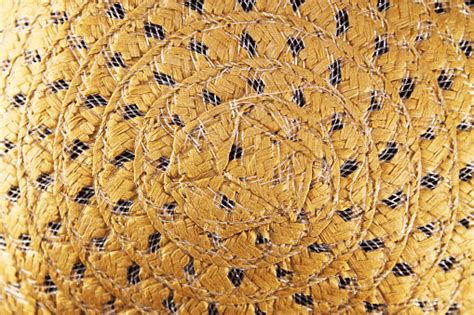 빈티지 밀 짚 모자 패션 남자 또는 여자 근접에 대 한 밀 짚 모자 텍스처 클로즈업입니다 매크로 사진 밀 짚 및 라인의 라인을 볼 수 있습니다 그리드 원형 나선형 및