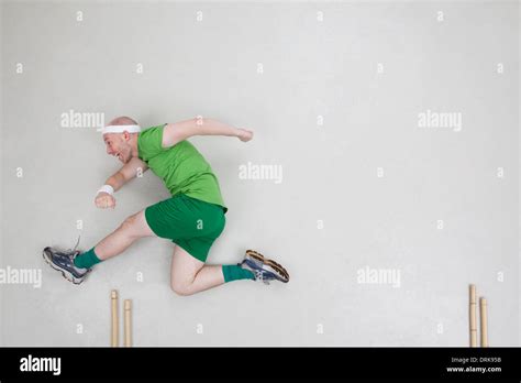 Man Jumping Over Hurdle Stock Photo Alamy