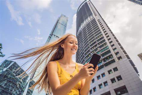woman tourist using navigation app on the mobile phone navigation map