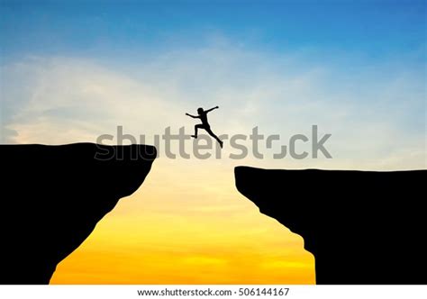 Courage Man Jump Through Gap Between Stock Photo Edit Now