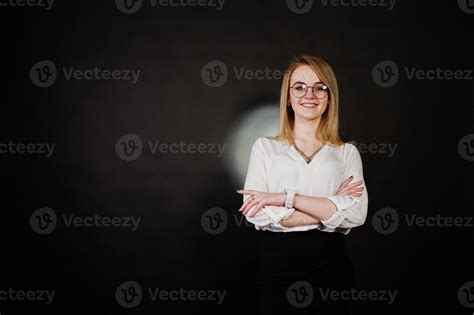 Studio Portrait Of Blonde Businesswoman In Glasses White Blouse And