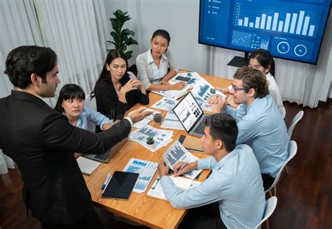 Group Of Business Analyst Team Analyzing Financial Data Report