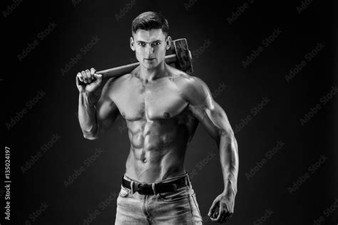 Muscular Man With Naked Torso Holding Big Hummer Isolated On Dark Grey Background Stock Photo