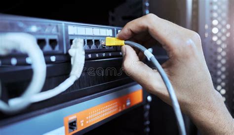 Hands Network Engineer And Server Cable In Server Room For Data Internet Or Web Connection