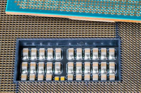 Electronic Micro Components In Computer Mainboard Socket And A Green Processor Detail Stock