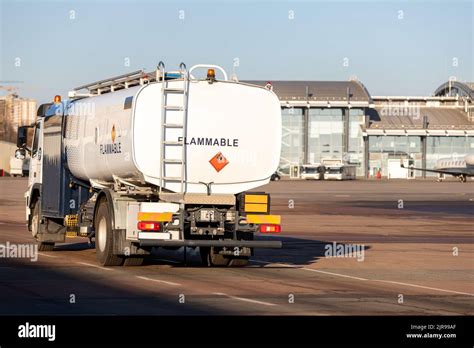 Back View Small Modern Fuel Tanker Truck Driving On Airfield Taxiway