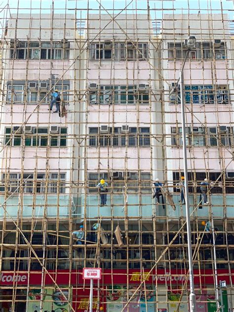 Workers Working On A Bamboo Scaffolding In Hong Kong Editorial Image