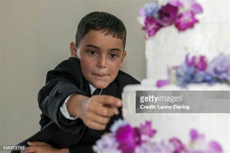 Sneaking Taste Of Cake Photos And Premium High Res Pictures Getty Images