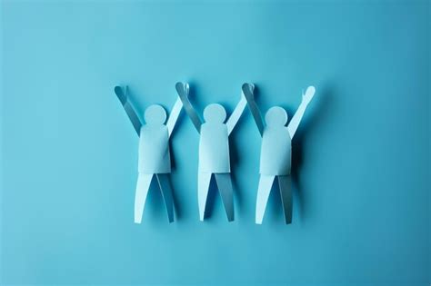 Premium Photo Conceptual Paper Cutout Figures Holding Hands On Blue Background