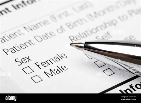 Pen Over Male Female Gender Option Checkboxes In A Document Form Stock