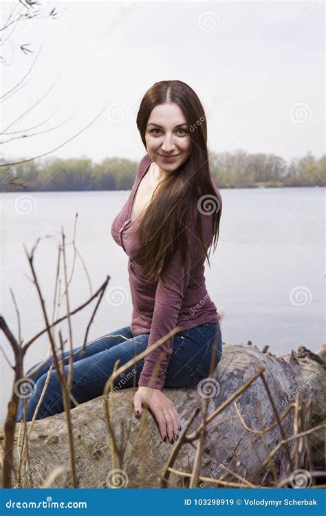 Beautiful Girl Sitting On A Log At The Beach Stock Image Image Of