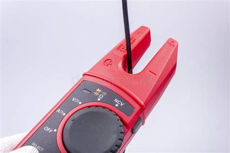 The Electrician Measures The Current In The Phase Wire With A Meter