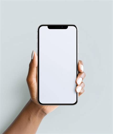 Premium Photo This Image Shows A Hand Holding A White Android Phone
