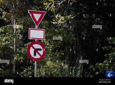 Road Sign Indicating No Right Turn Allowed And To Yield To The Incoming