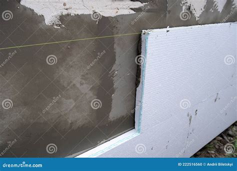 Installation Of Styrofoam Insulation Sheets On House Facade Wall For Thermal Protection Stock