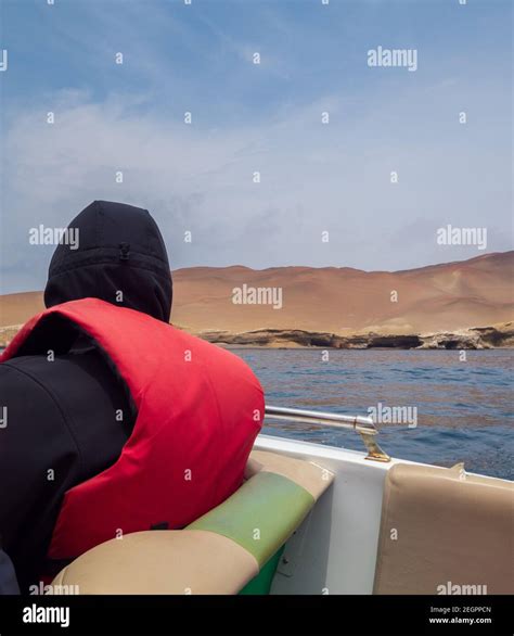 Man Lost In Thought Admires The View Is Wearing A Life Jacket Inside A