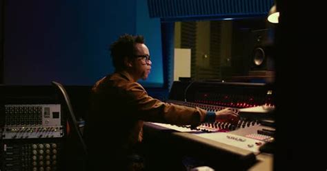 Music Producer Operating Mixing Console In Control Room Technology