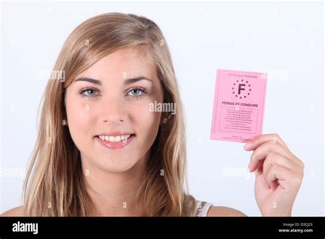 Blonde Girl Showing Driving License Stock Photo Alamy