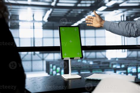 Engineers Using Isolated Screen Tablet In Data Center Managing Server
