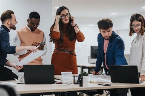 Creative People Brainstorming And Analyzing Reports For Business Growth And Expansion Stock