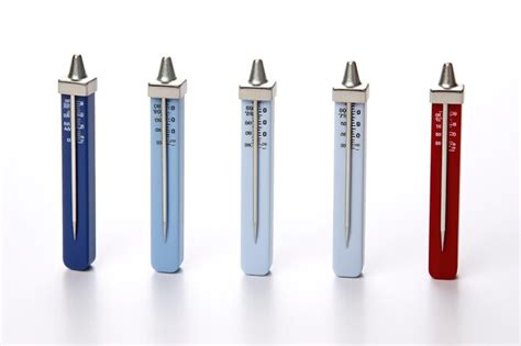 A Row Of Six White Thermometers With Different Temperature Readings On