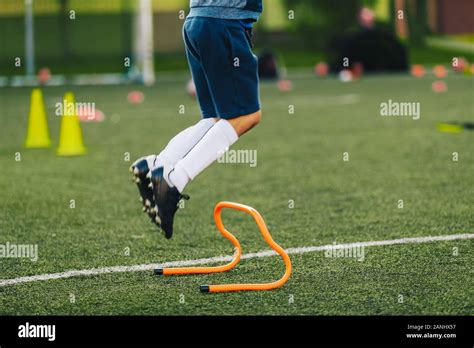 soccer player jumping on training session pitch football training
