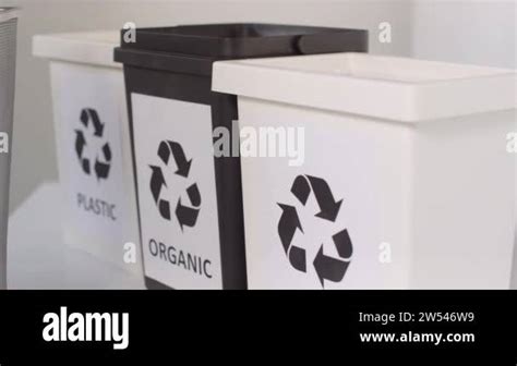 process of sorting garbage in sorting containers for recycling stock