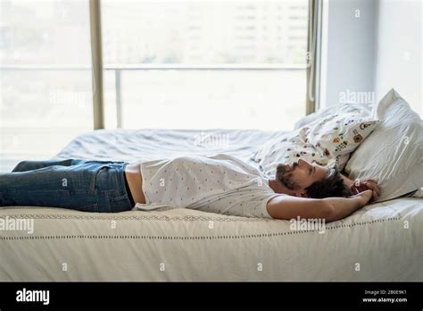 Person Lying On Bed Photos Download The Best Free Person Pbwe