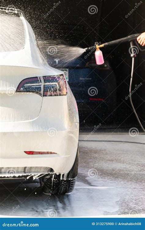 Eco Friendly Cleaning Washing An Electric Car At Home Stock Photo Image Of White Suburban