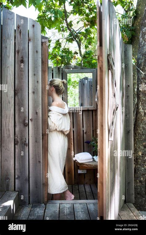 Woman Wearing Robe In Outdoor Shower Stock Photo Alamy