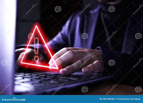Hands Of A Businessman Using The Computer On Fraudulent Pages Caution Symbol Of Danger Of