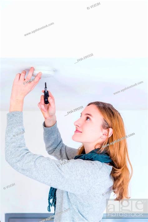Woman Installing A Smoke Detector Stock Photo Picture And Rights Managed Image Pic PHA