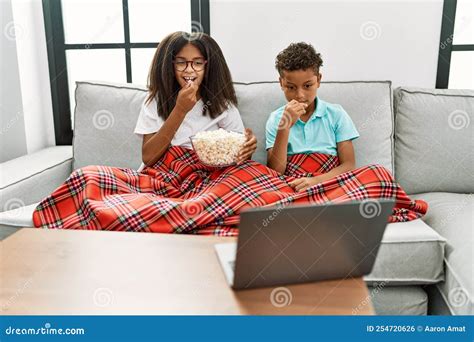 Brother And Babe Watching Movie Sitting On Sofa At Home Stock Photo Image Of Online Glasses
