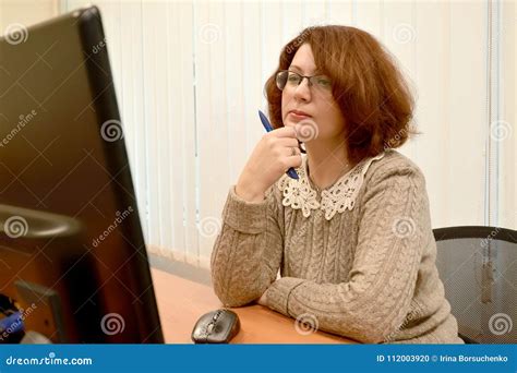 The Woman With Interest Looks In The Computer Monitor Stock Photo Image Of Averages