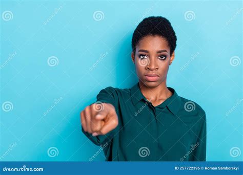 Photo Of Serious Strict Androgynous Human Wear Green Shirt Pointing