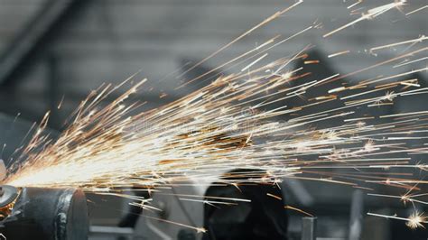A Worker At A Metalworking Factory Processes Metal Stock Footage