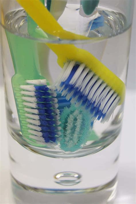 Download Toothbrushesin Glass Water Submersion Wallpaper